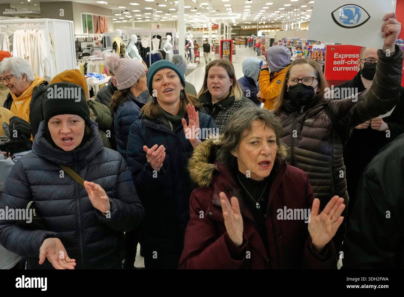Community members and neighbors of people detained by ICE protest at a ...
