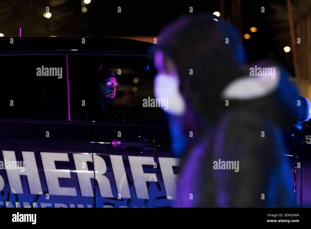 Fort Snelling, Minnesota, USA. 17th Jan, 2026. A police officer watches ...