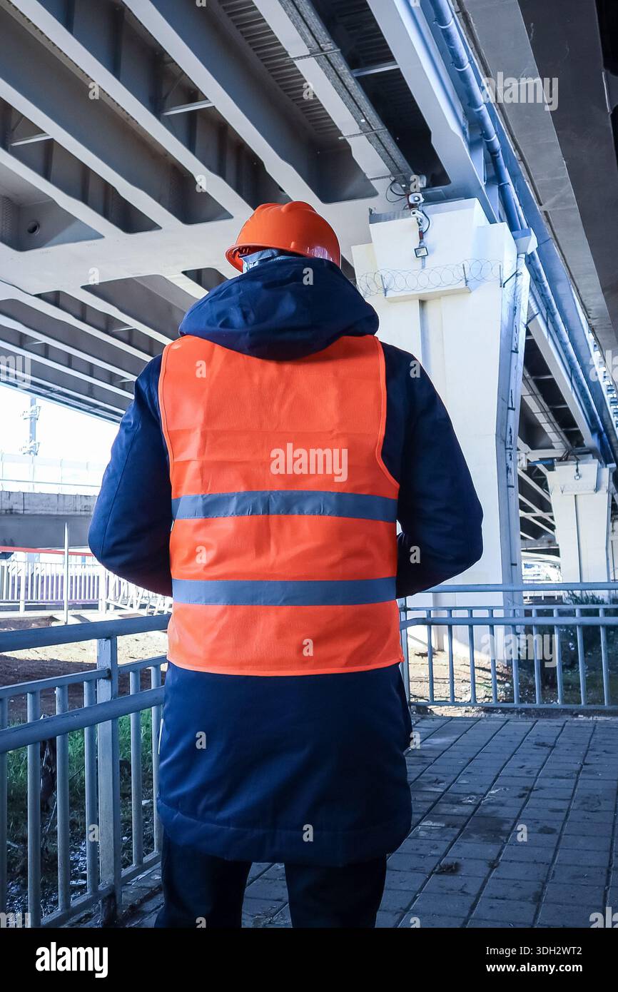 Construction worker inspecting highway overpass hi-res stock ...