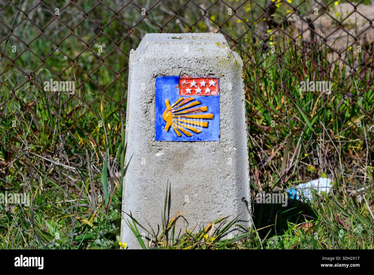 Small stone monolith marking the Camino de Santiago route, showing the ...