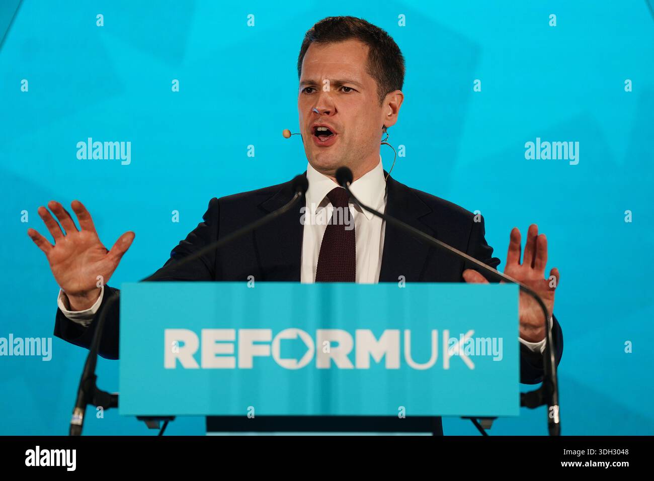 Robert Jenrick speaks during a Reform UK rally at Newark Showground in ...
