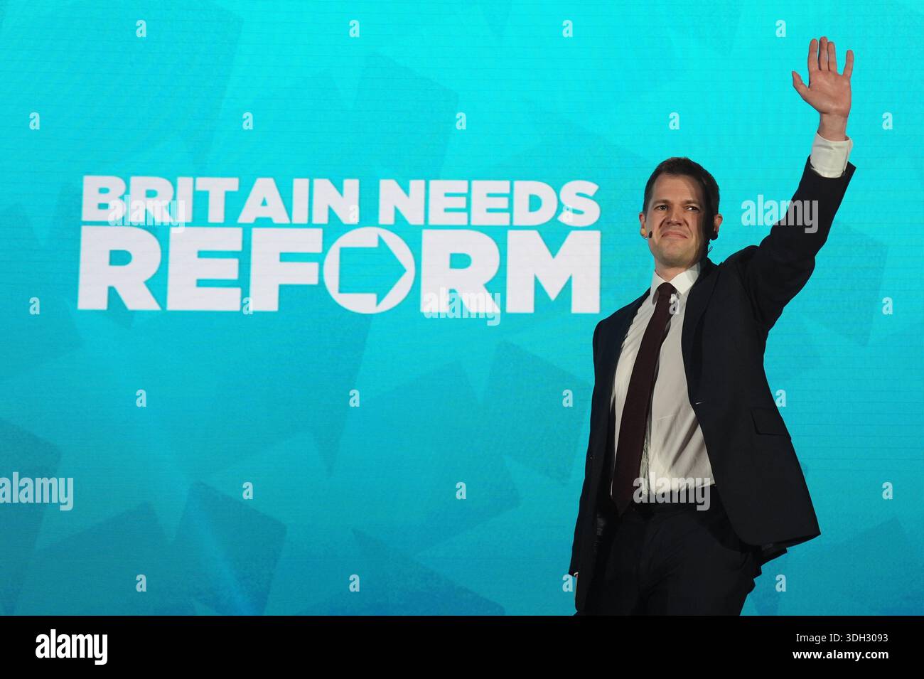 Robert Jenrick walks on stage prior to speaking during a Reform UK ...