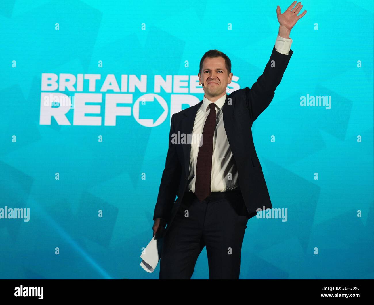 Robert Jenrick walks on stage prior to speaking during a Reform UK ...