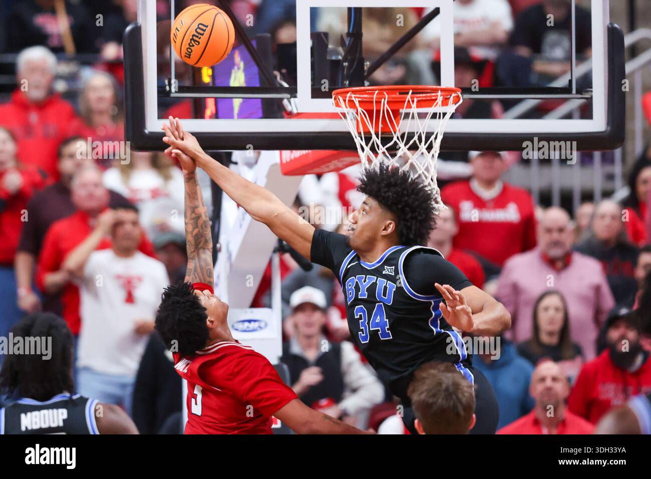 BYU forward Abdullah Ahmed (34) attempts to block a shot from Texas ...