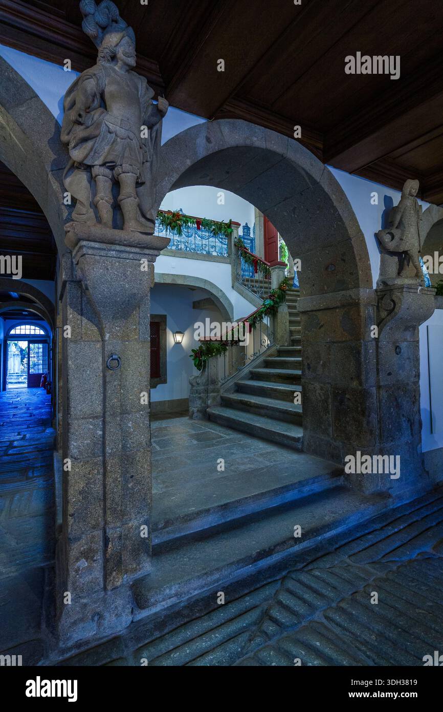grand interior space defined by massive stone arches and columns. The ...