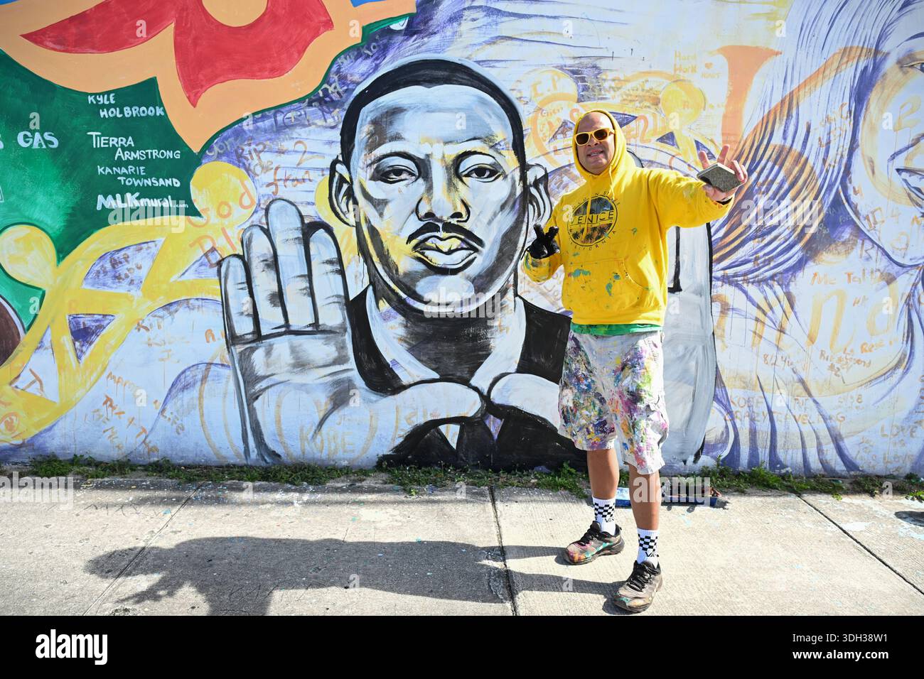 Miami, USA. 19th Jan, 2026. Artist Kyle Holbrook paints a mural of ...