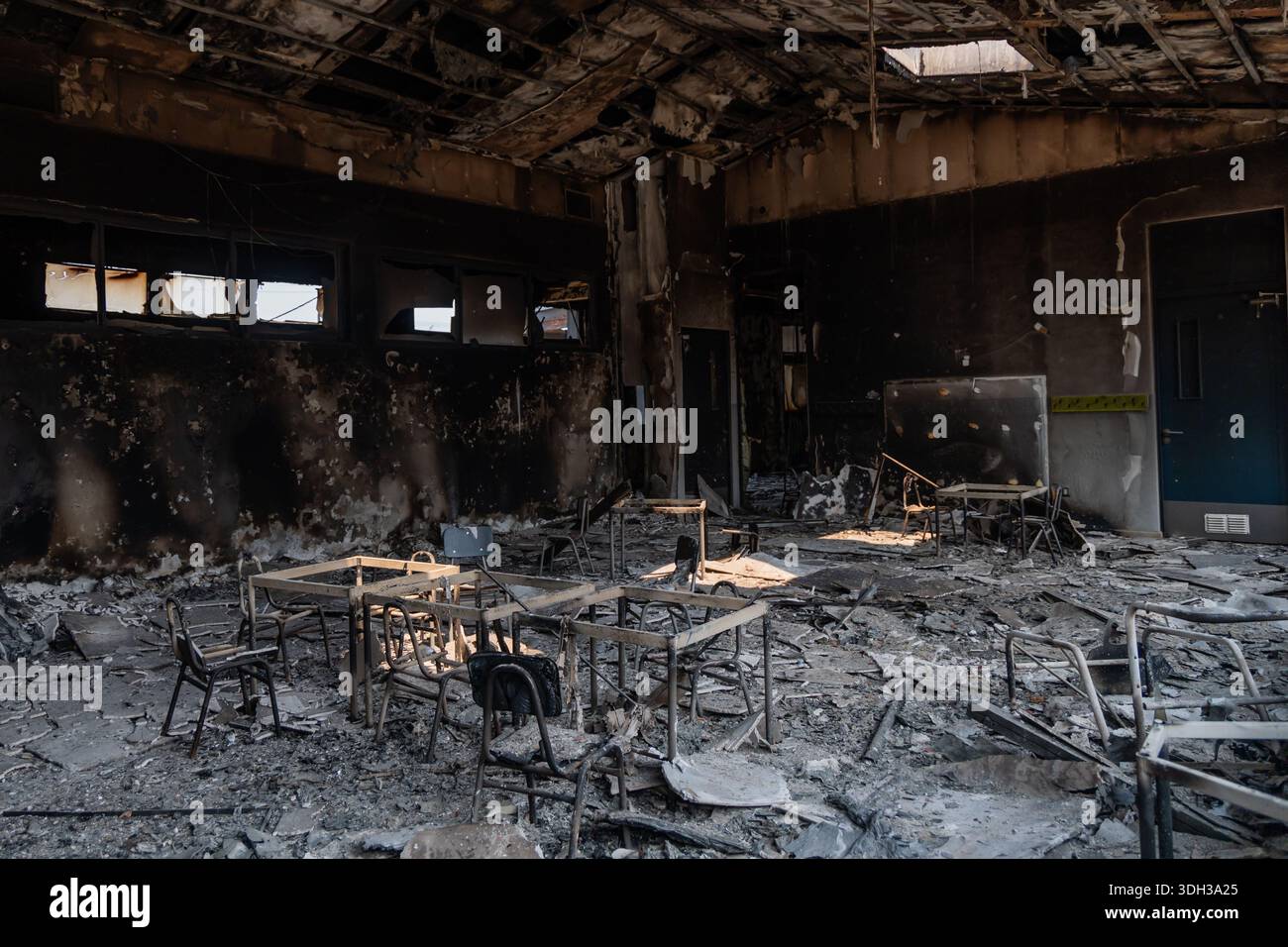 A classroom is seen inside a school burned by wildfires in Punta de ...