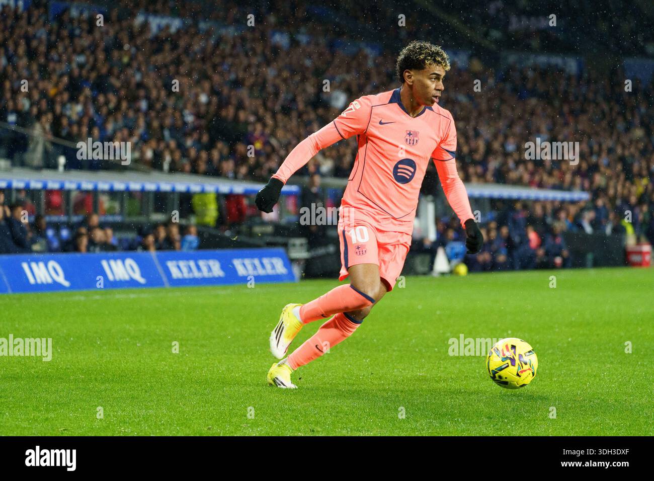 in action during the La Liga game between Real Sociedad and FC ...