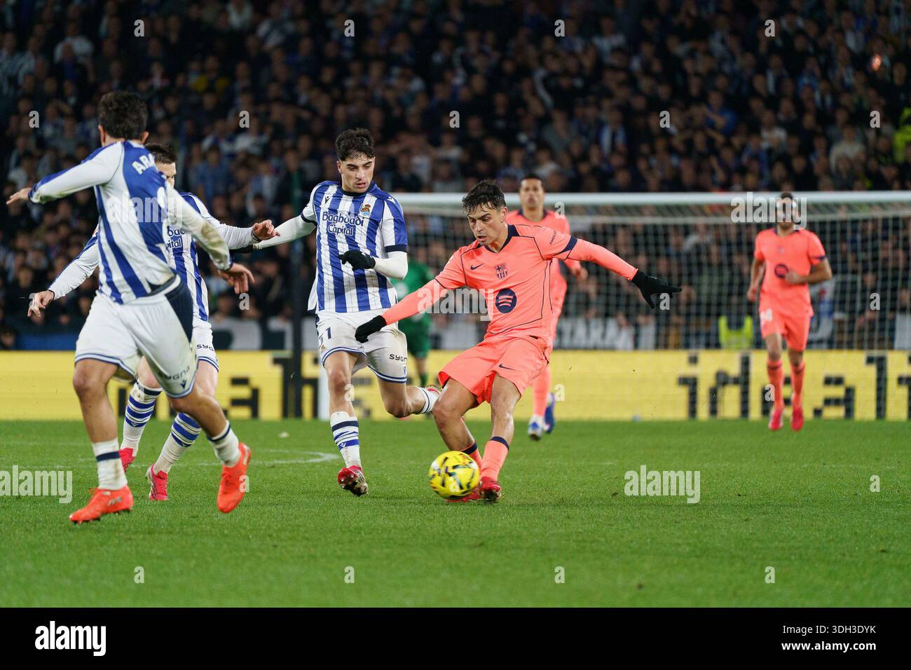 in action during the La Liga game between Real Sociedad and FC ...