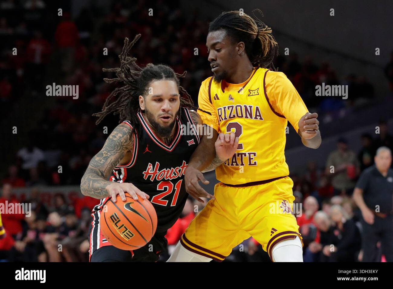 Houston guard Emanuel Sharp (21) attempts to drive around Arizona State ...