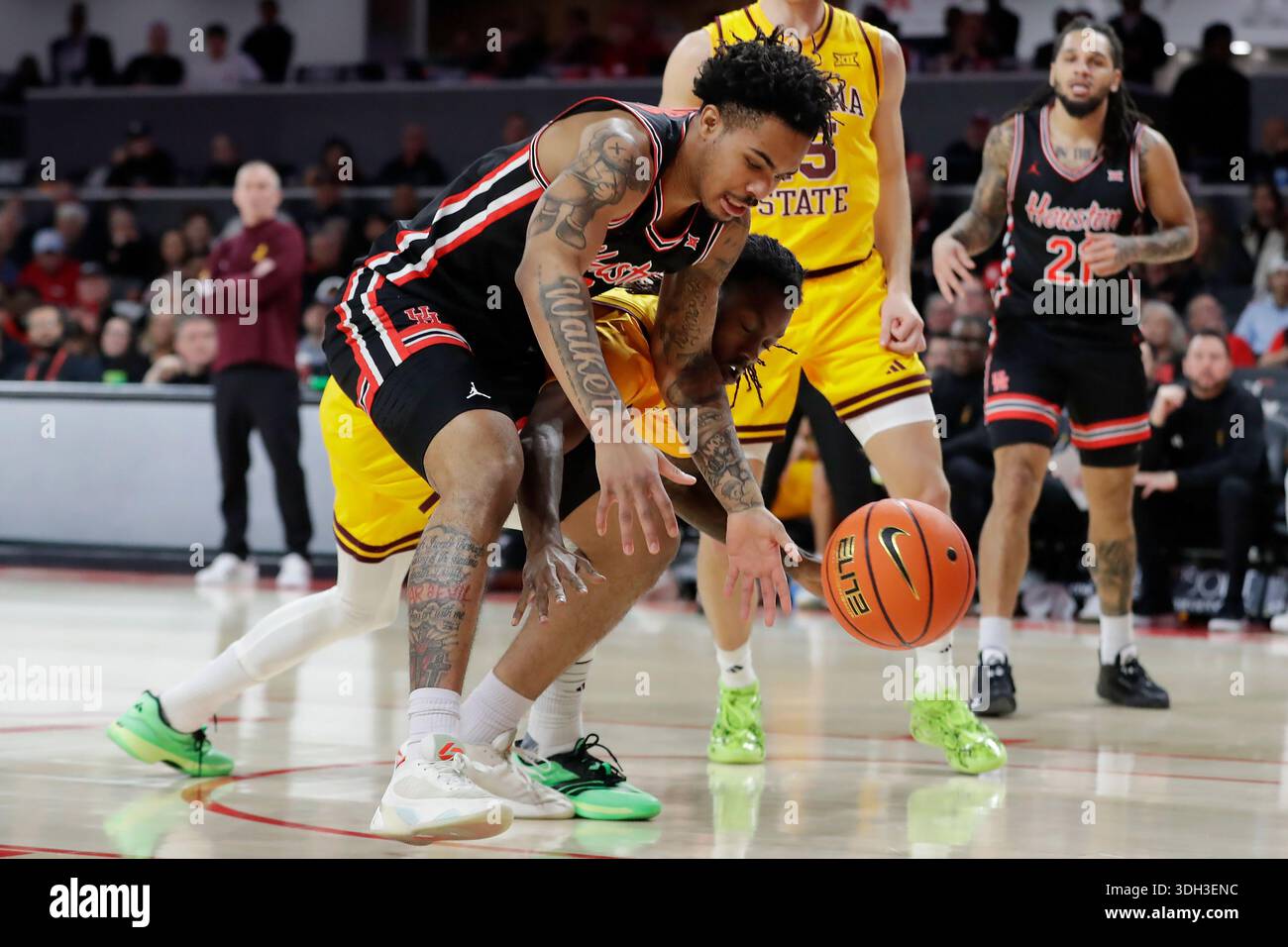 Houston guard Ramon Walker Jr., left, has to ball knocked away on an ...
