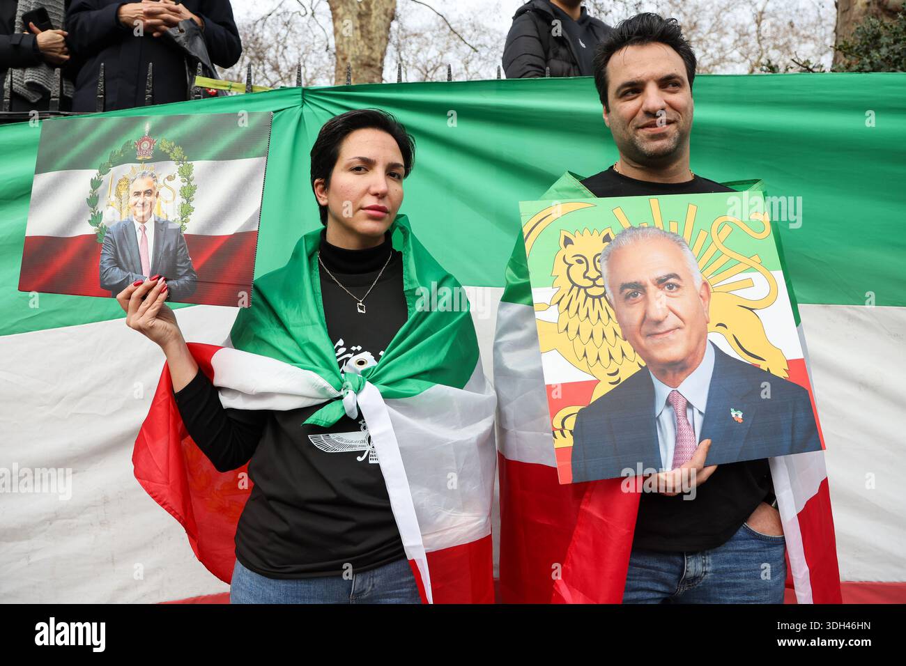 Iranian protesters hold a photograph of Reza Pahlavi during a Free Iran ...