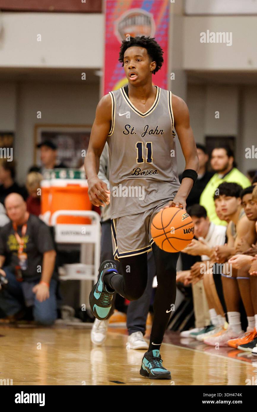 St. John Bosco Christian Collins (11) in action against Christopher ...