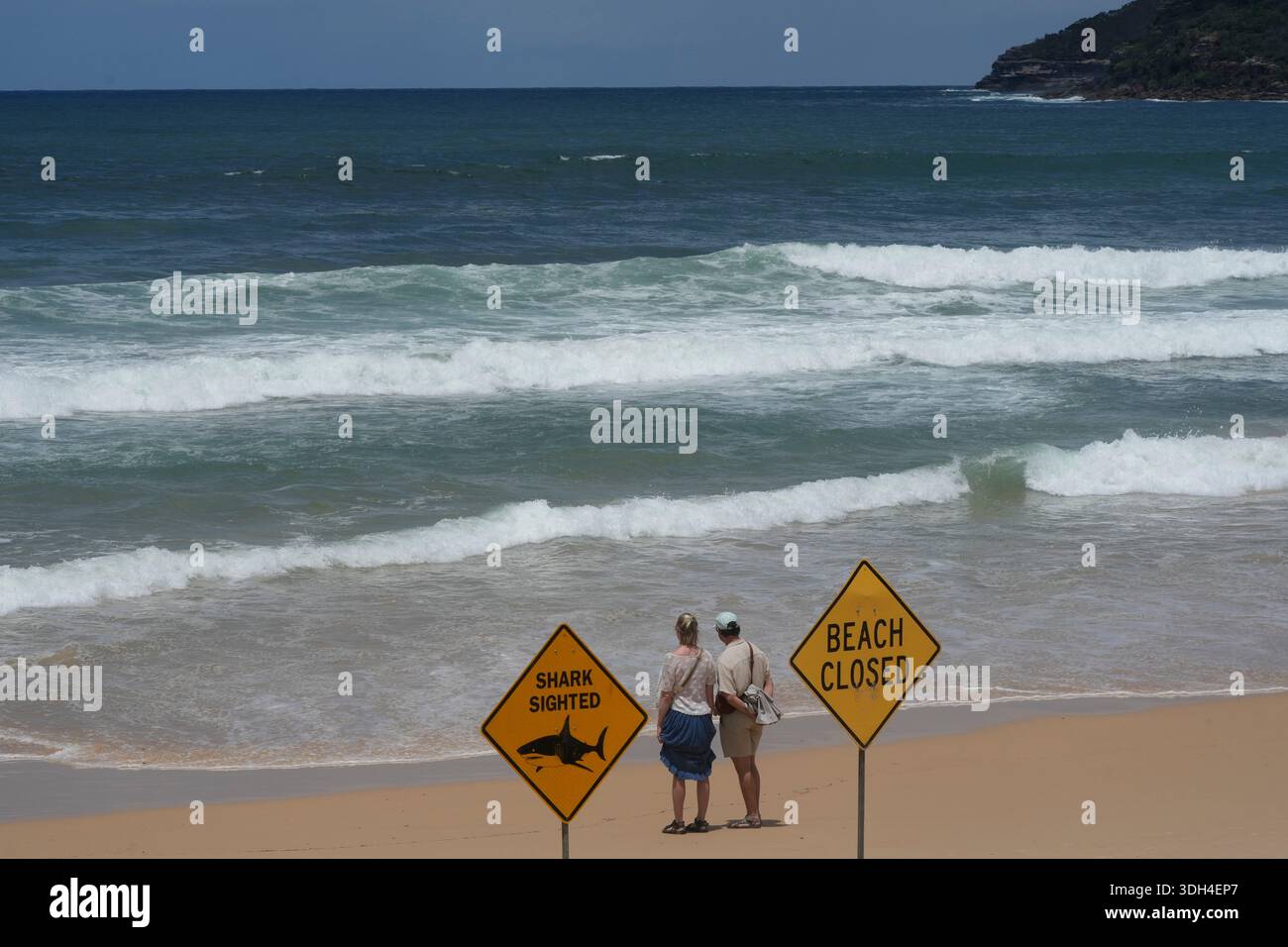 A couple look out to sea at North Steyne Beach in Sydney, Tuesday, Jan ...