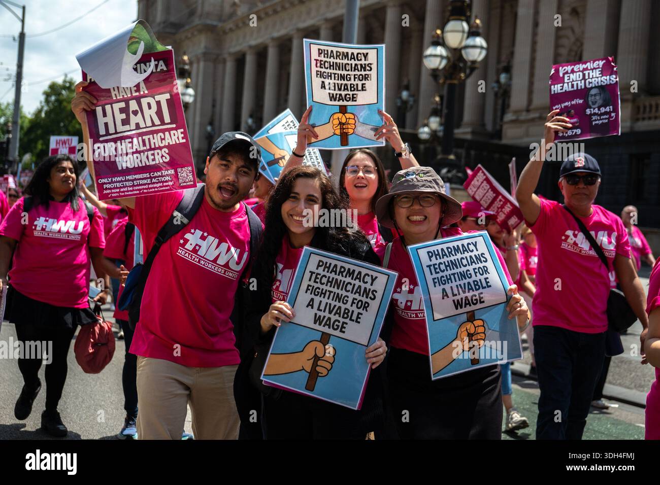 Healthcare workers march during a statewide strike over pay and ...