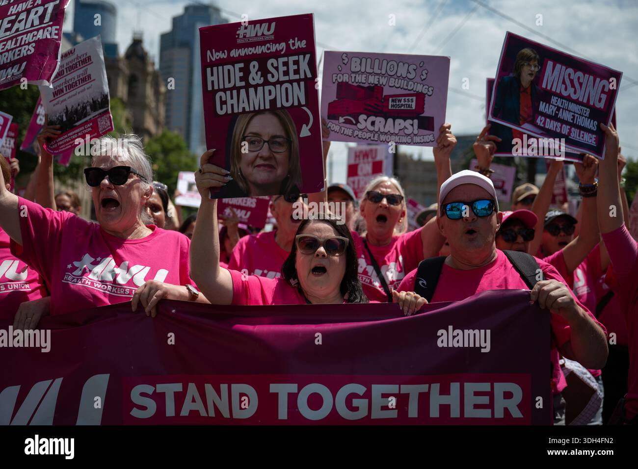 Healthcare workers march during a statewide strike over pay and ...