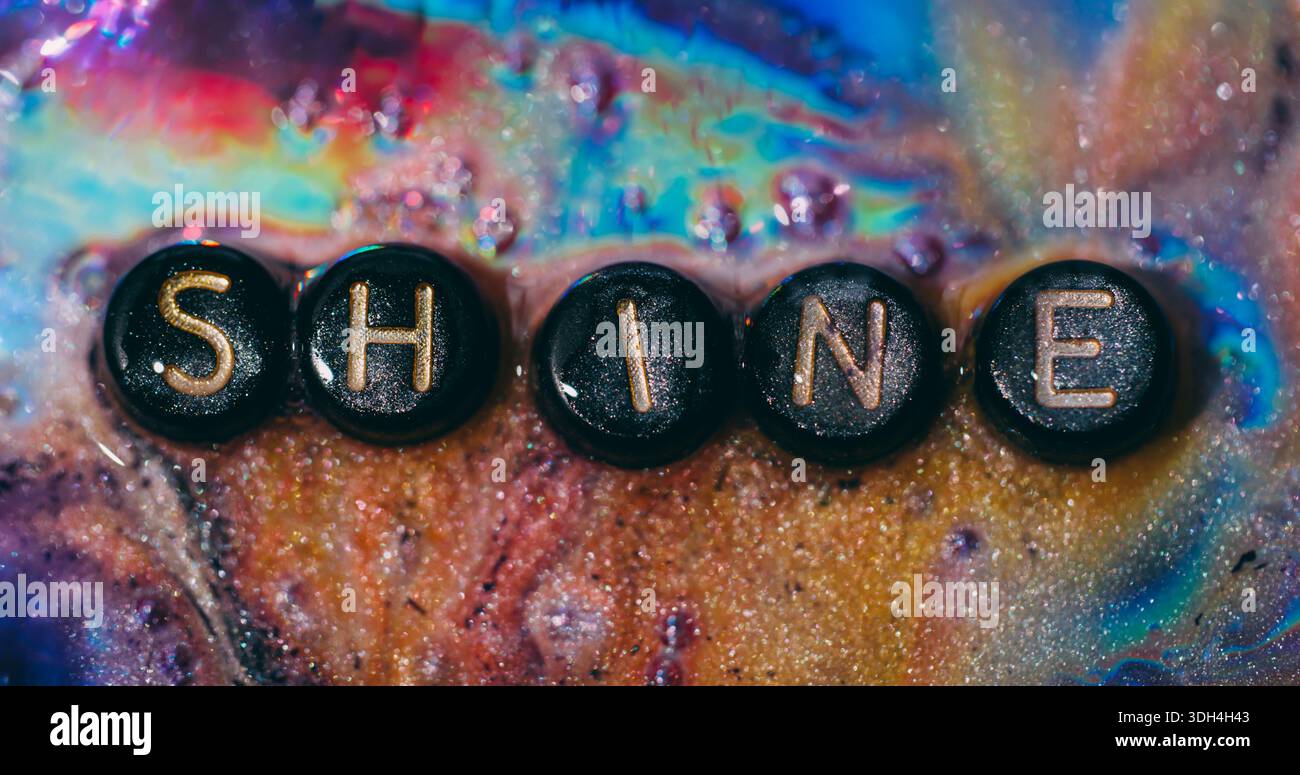Shine word glitter paint liquid mix texture bright Stock Photo - Alamy