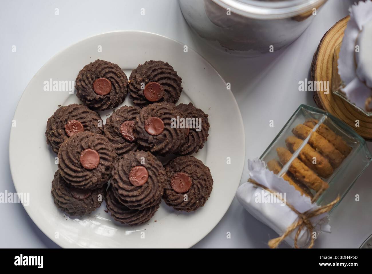 Homemade chocolate cookies with swirled ridges and a chocolate button ...