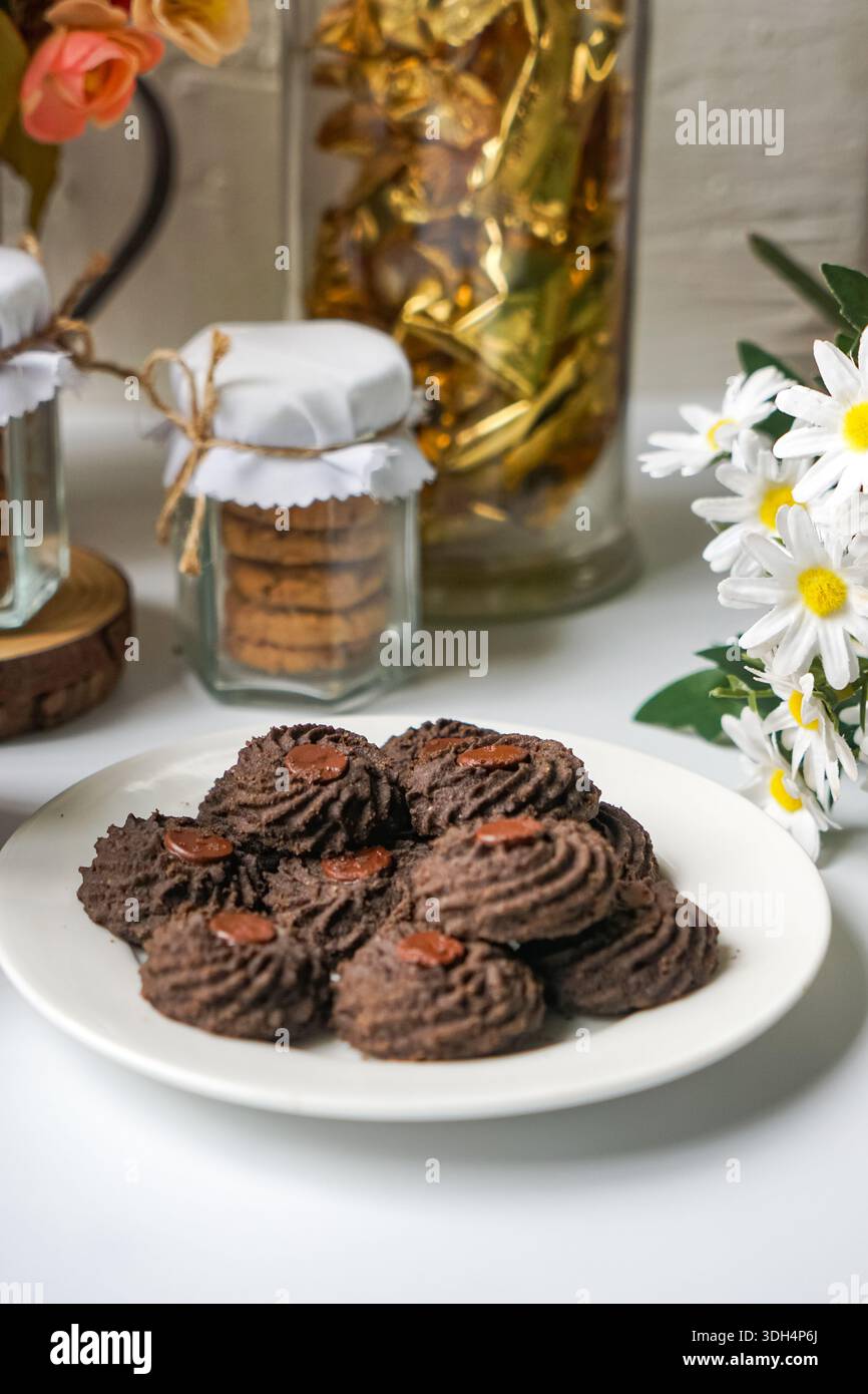 Homemade chocolate cookies with swirled ridges and a chocolate button ...