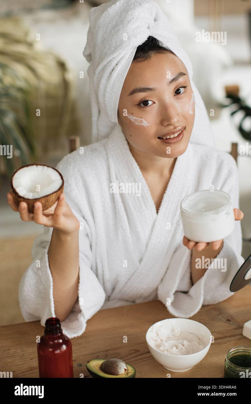 Woman Applying Face Cream Stock Photo - Alamy