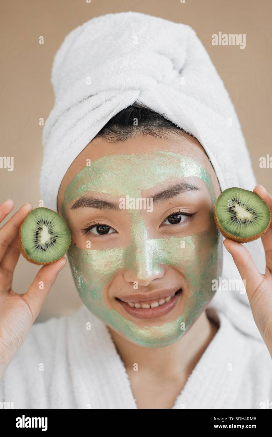 Woman With Kiwi Face Mask Stock Photo - Alamy
