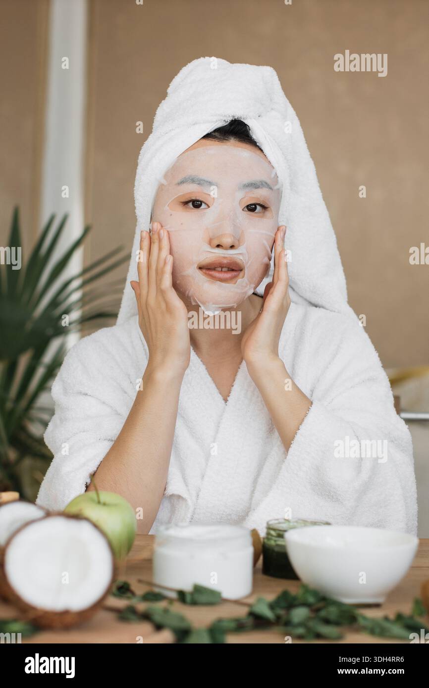 Woman Applying Sheet Mask Stock Photo - Alamy