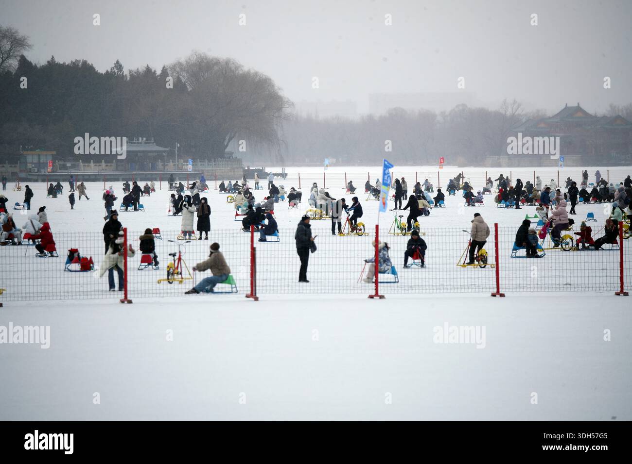 Visitors enjoy ice activities at the Summer Palace Kunming Lake ice ...