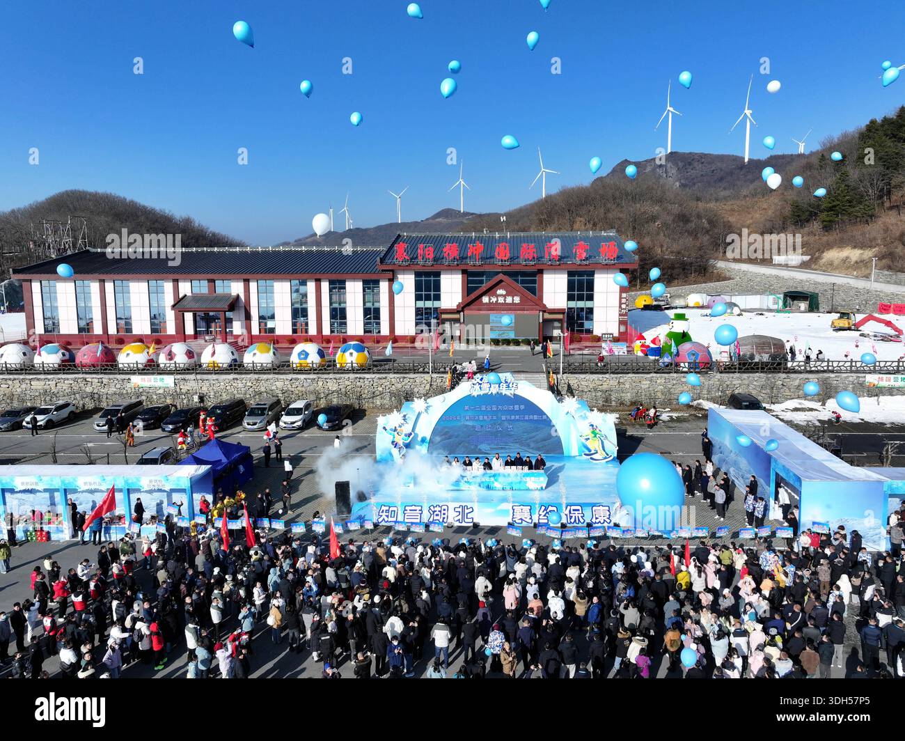 People take part in snow activities at Hengchong International Ski ...
