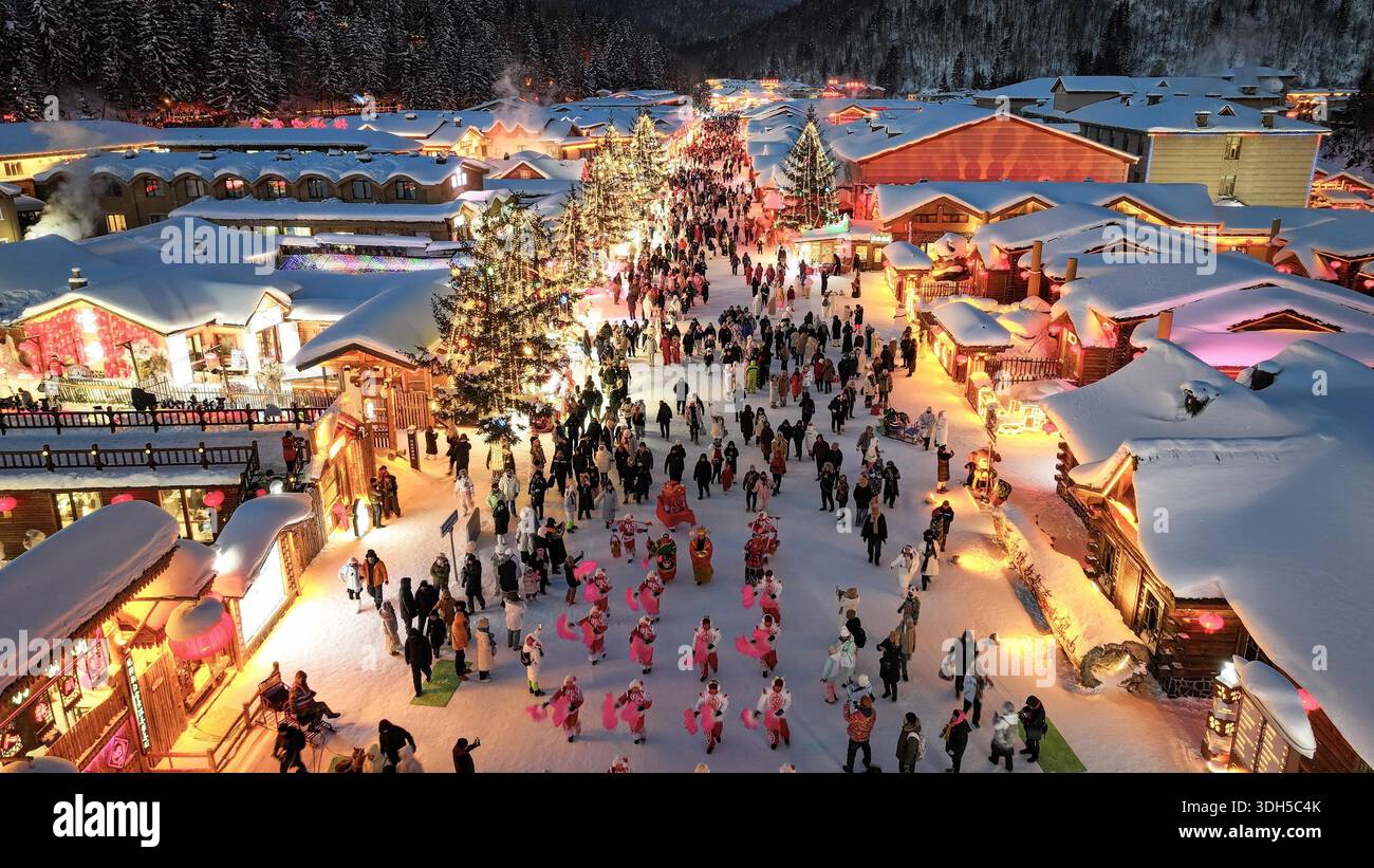 Tourists enjoy snow scenery at China Snow Village in Hailin City ...