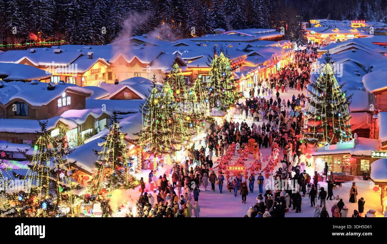 Tourists enjoy snow scenery at China Snow Village in Hailin City ...