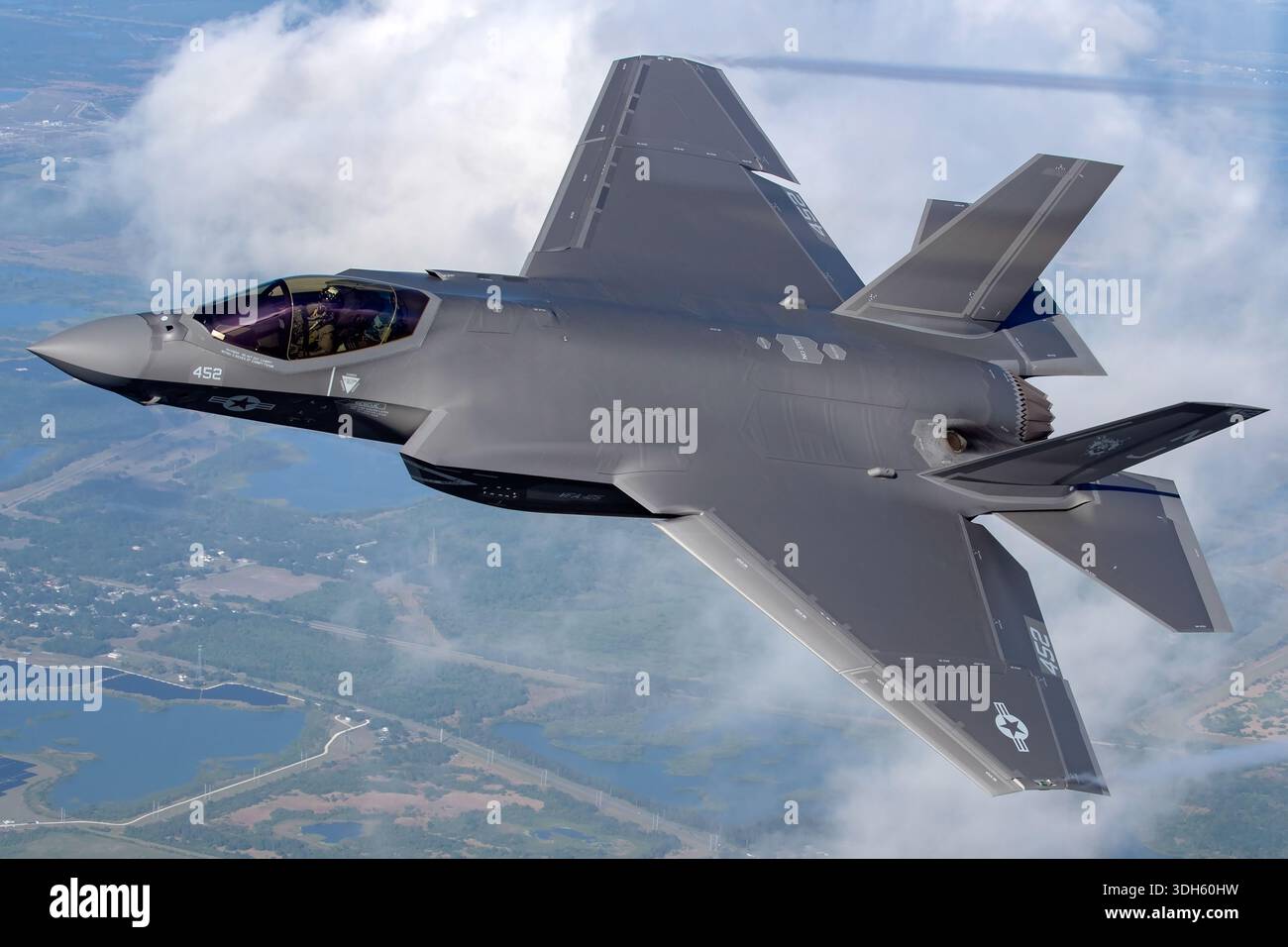 This air-to-air photograph features a U.S. Navy Lockheed Martin F-35C ...