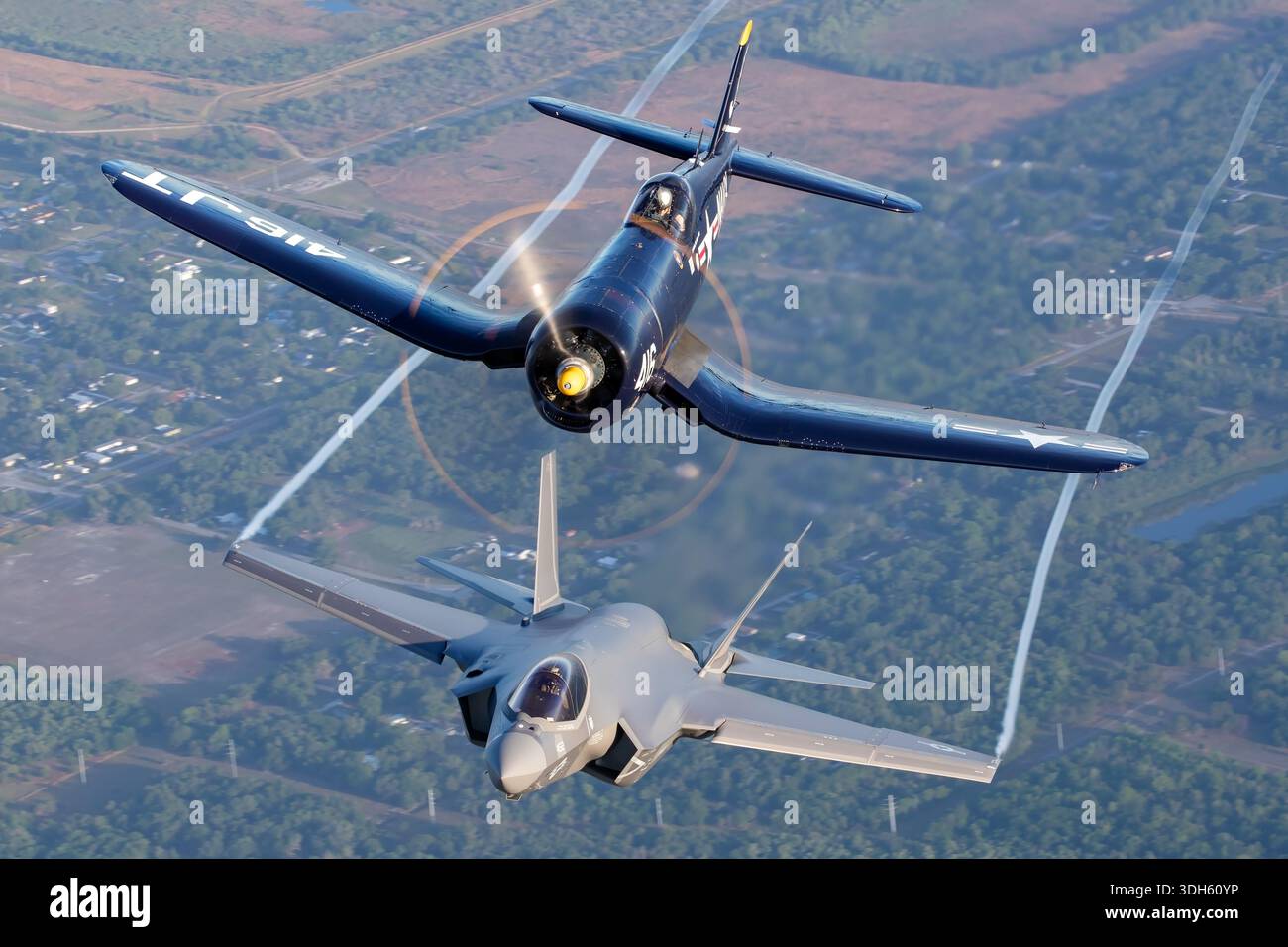 Air to air view of two generations of naval aviation aircraft flying ...