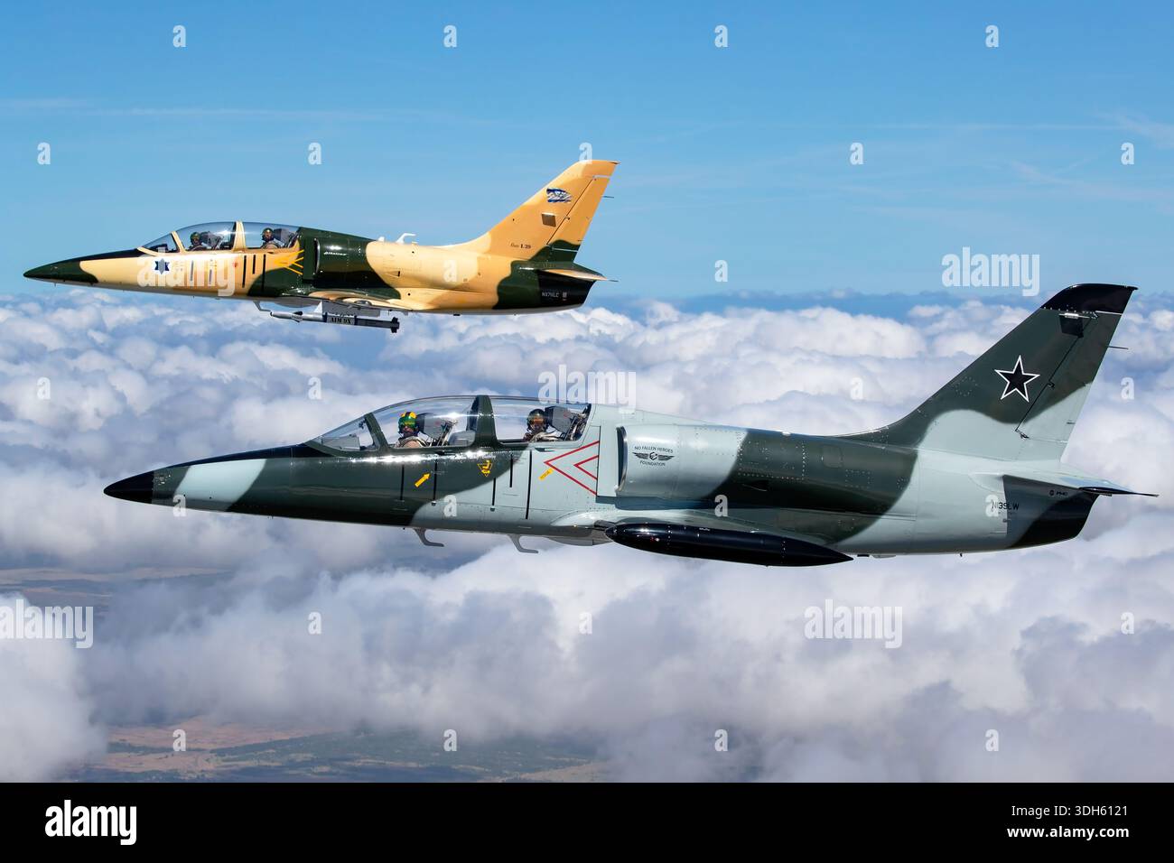 This image shows two Aero L-39 aircraft in formation flight at the Sun ...