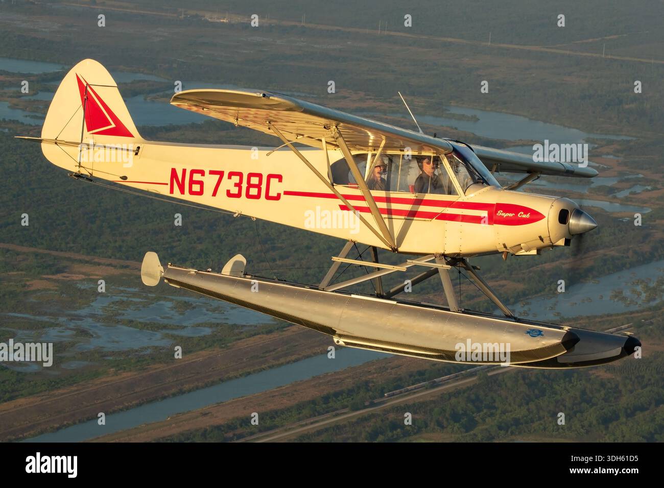 The photograph shows a Piper PA-18 Super Cub N6738C configured with ...
