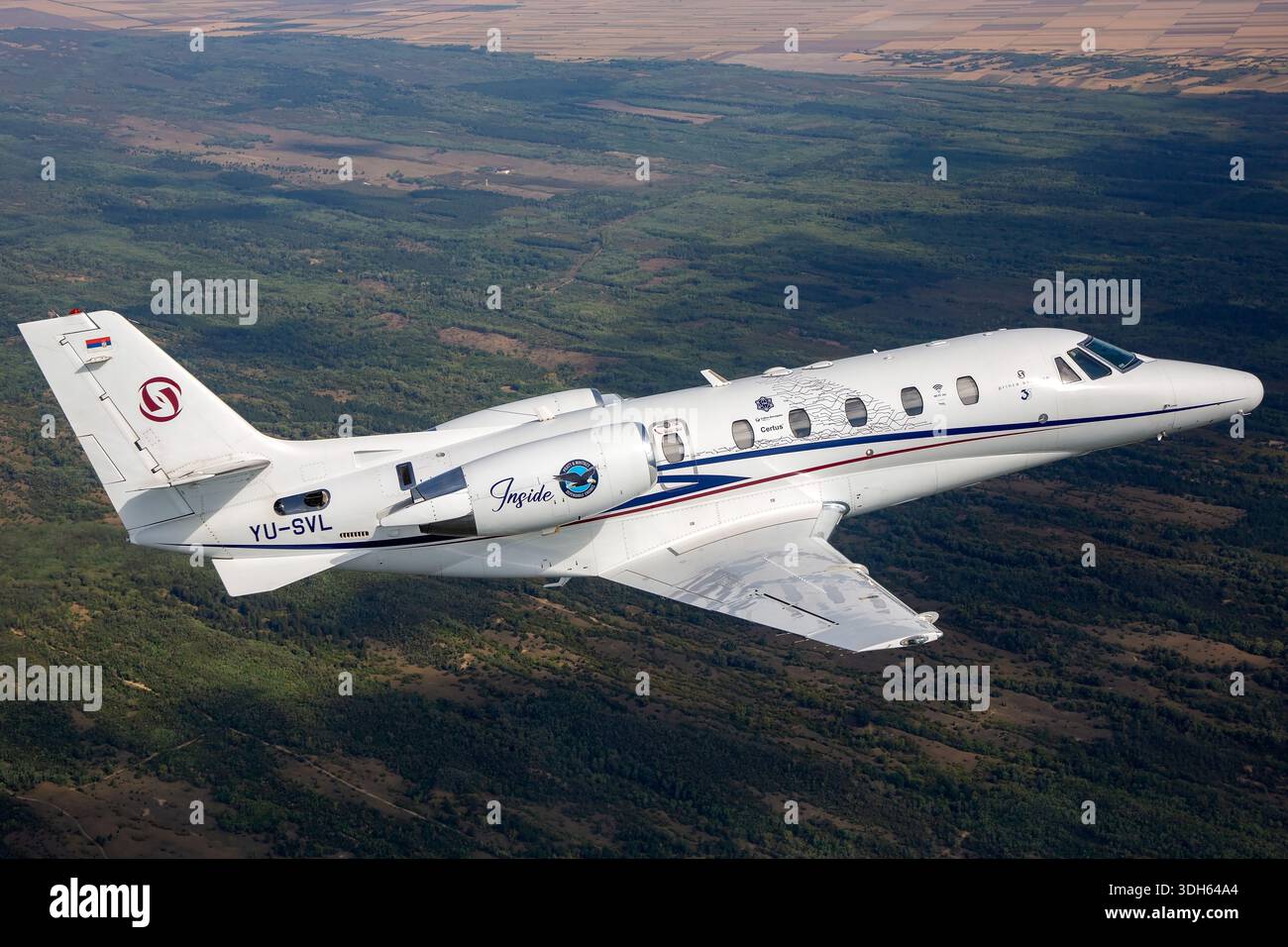 This image features a Cessna 560XL Citation XLS business jet in air-to ...