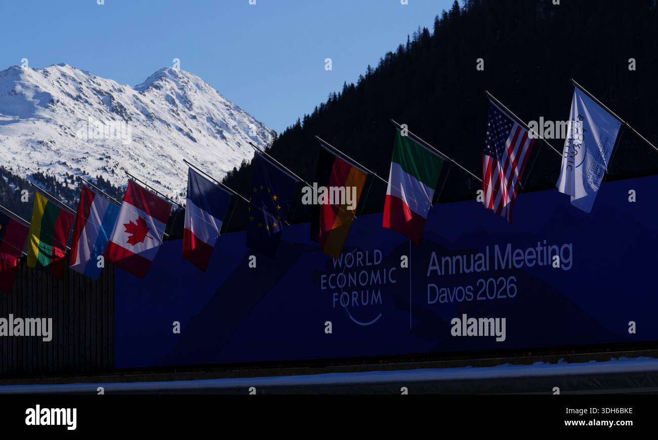 Davos, Switzerland. 20th Jan, 2026. World flags are pictured against a ...