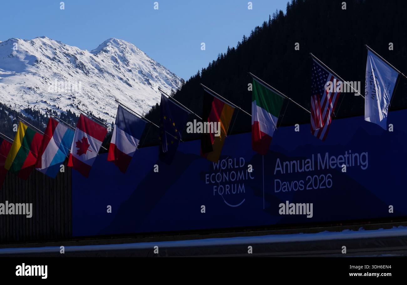 Davos, Switzerland. 20th Jan, 2026. World flags are pictured against a ...