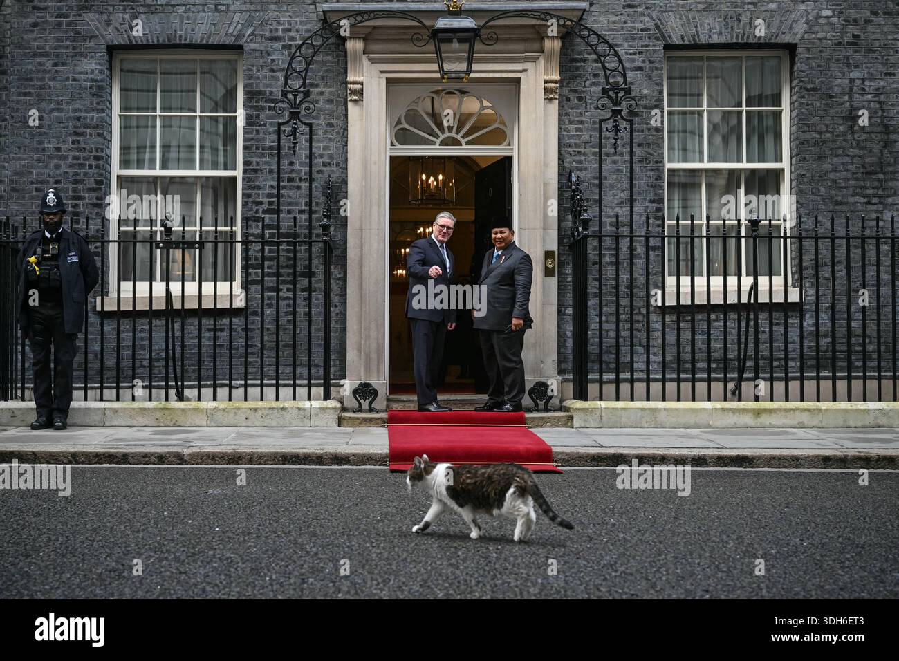 Larry the cat walks past as Prime Minister Sir Keir Starmer welcomes ...