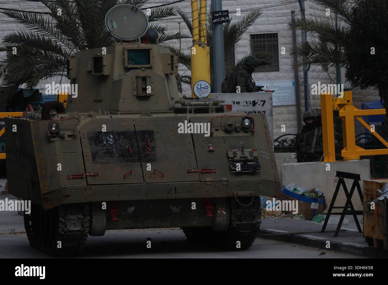 Hebron, Palestinian Territories. 20th Jan, 2026. An Israeli armoured ...
