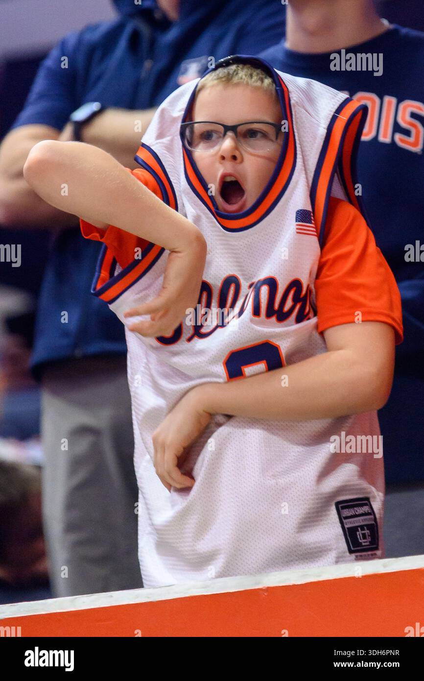 A young Illini fan cheers during an NCAA college basketball game ...