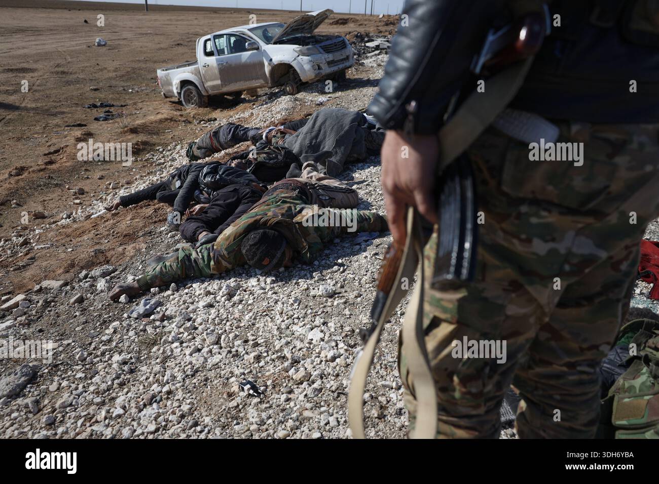The bodies of retreating Syrian Democratic Forces (SDF) fighters lie on ...