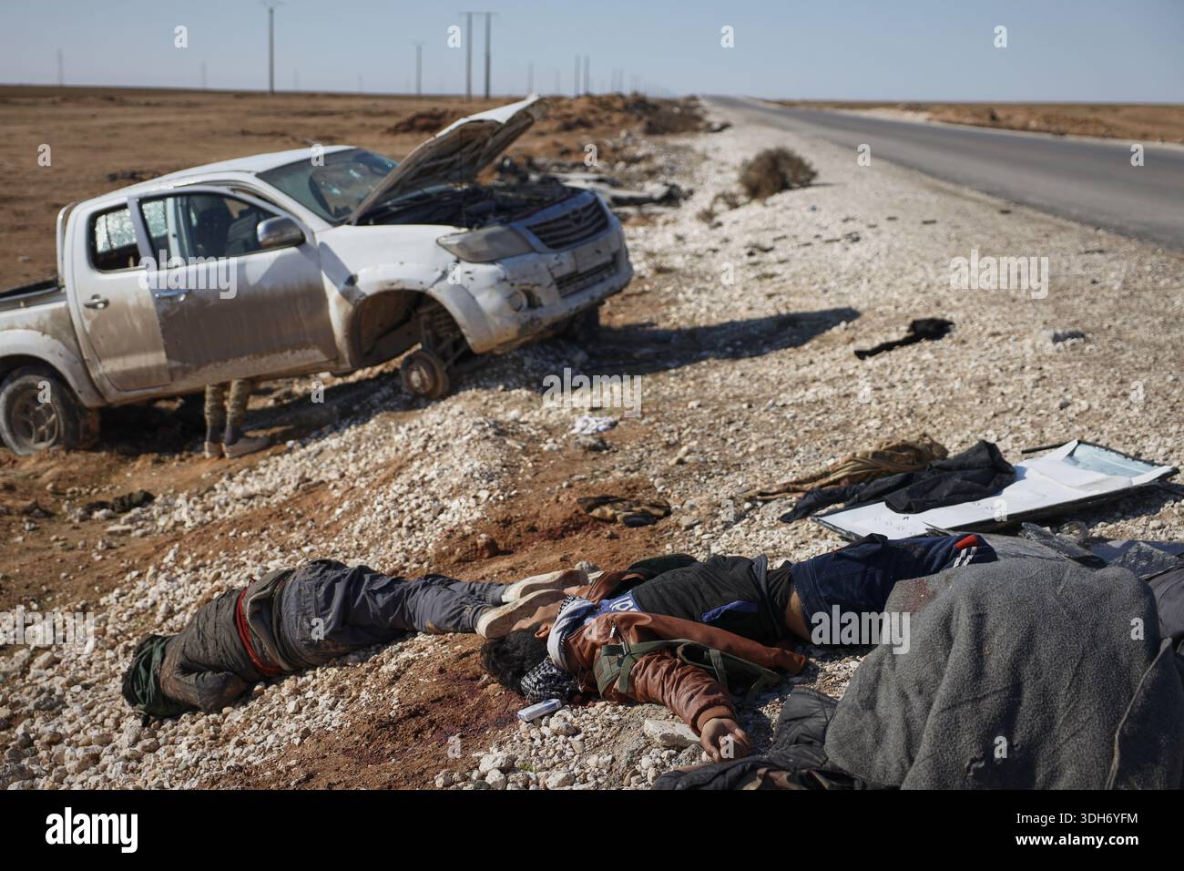 The bodies of retreating Syrian Democratic Forces (SDF) fighters lie on ...