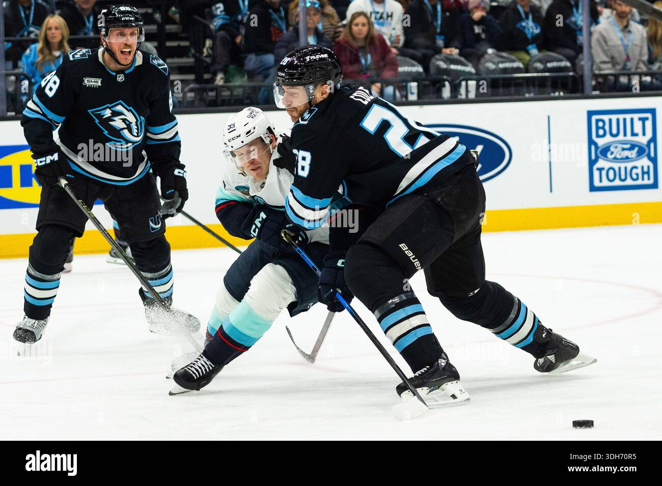Utah Mammoth defenseman Ian Cole (28) fights for the puck against ...