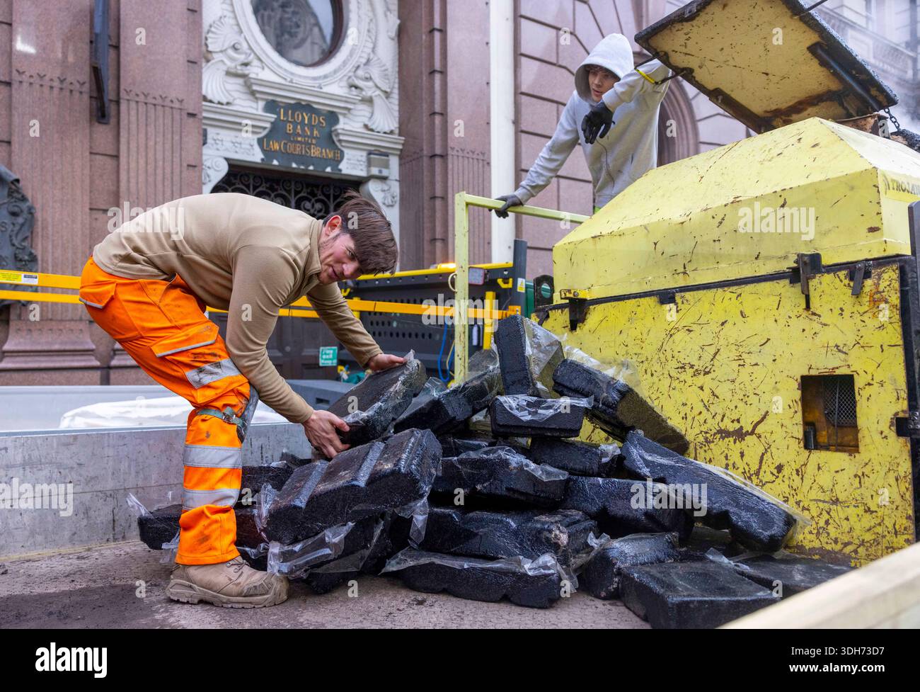 Workmen using asphalt surfacing roads driveways airport runways hi-res ...