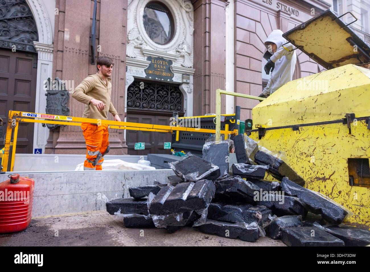 Workmen using asphalt surfacing roads driveways airport runways hi-res ...