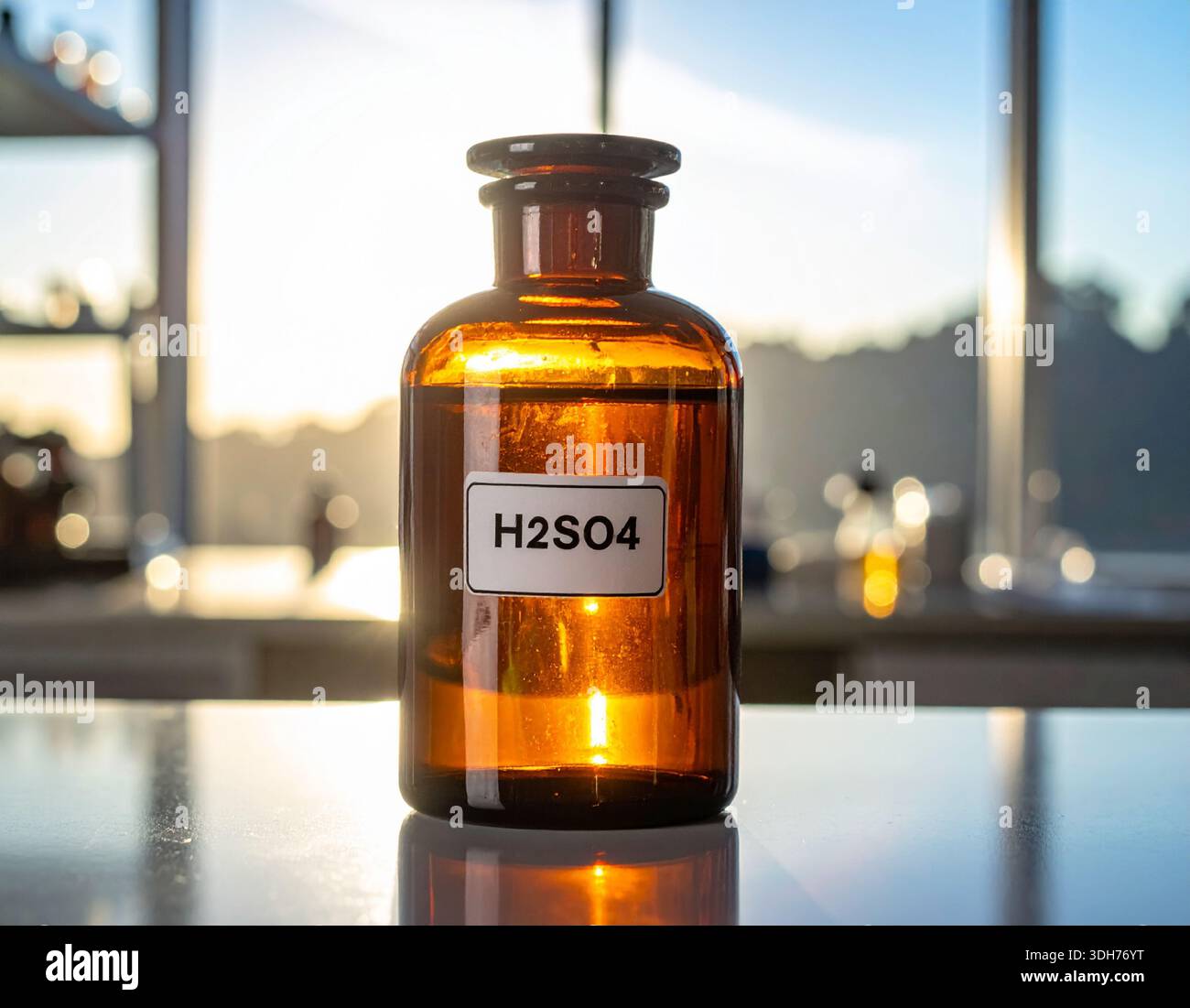 Laboratory glass with H2SO4 Stock Photo - Alamy