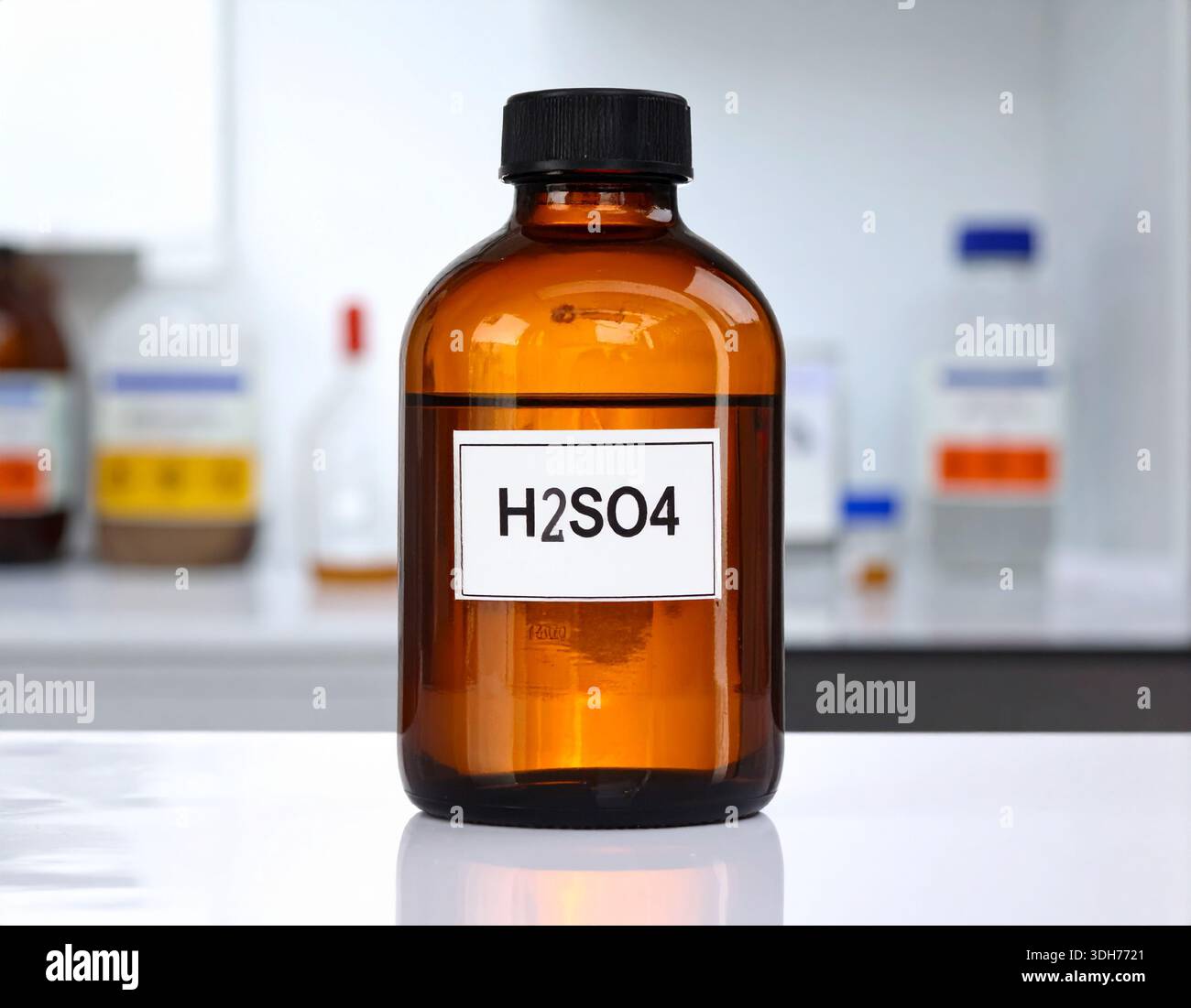 Laboratory glass with H2SO4 Stock Photo - Alamy