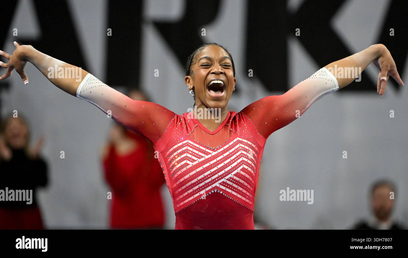 Arkansas gymnast Morgan Price competes on the beam during an NCAA ...