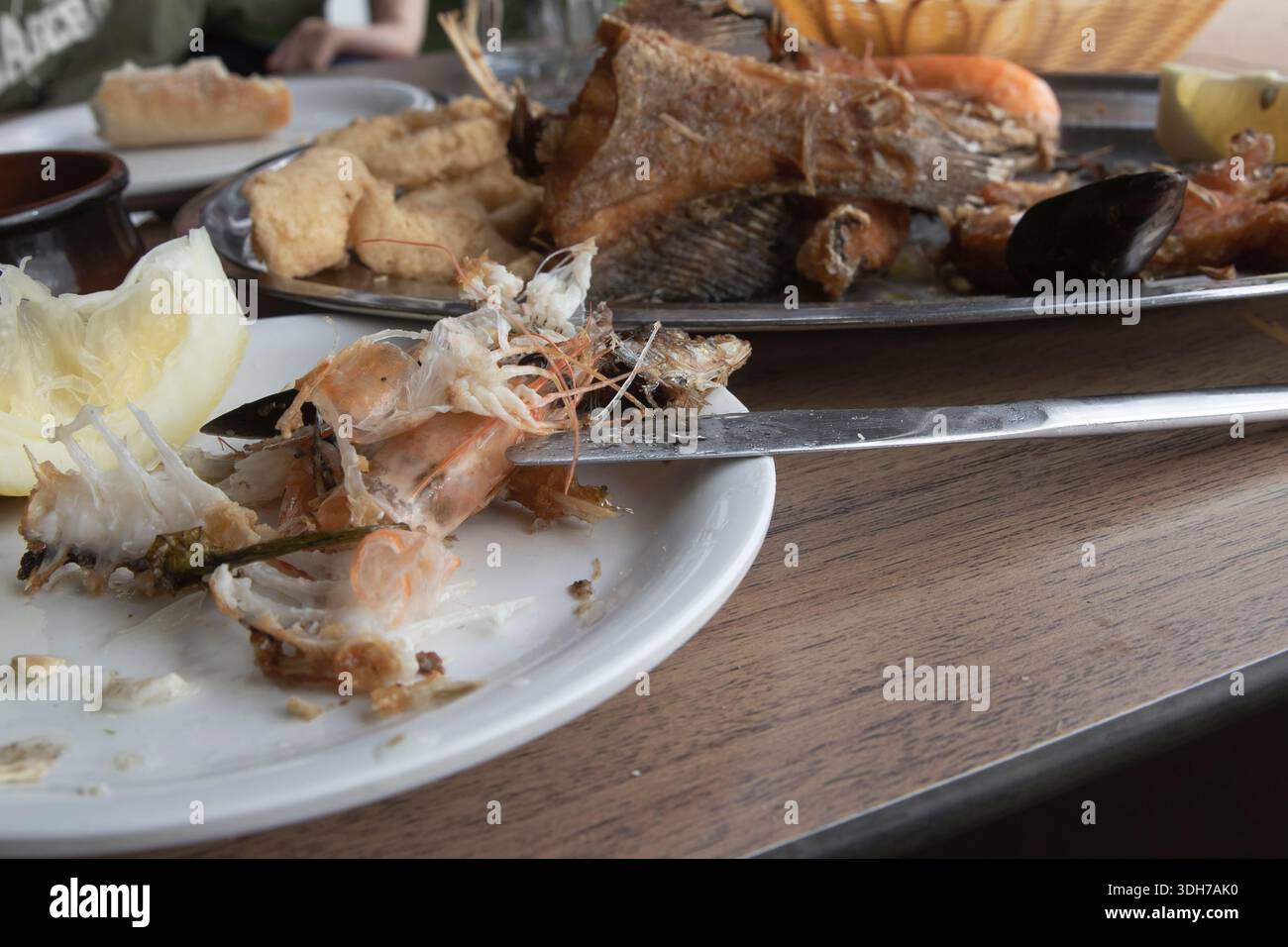 Plate leftover fried fish hi-res stock photography and images - Alamy