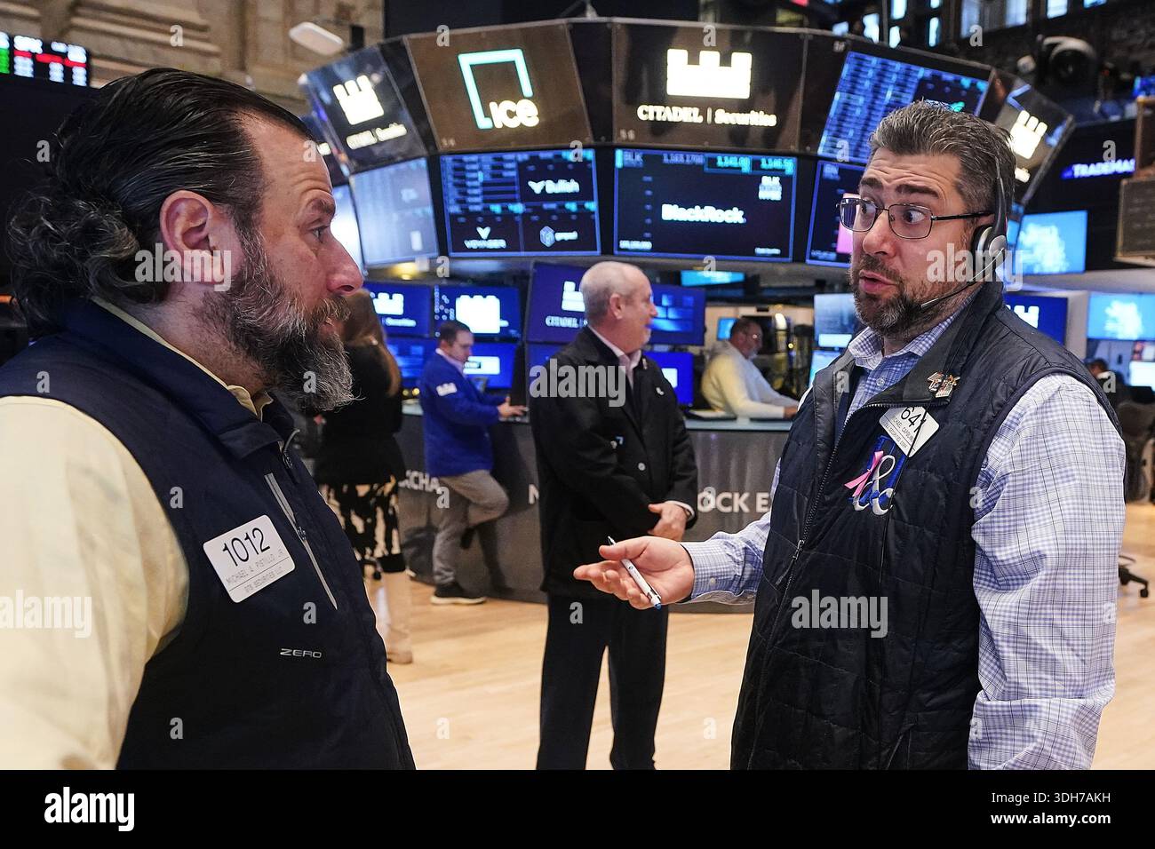 Specialist Michael Pistillo, left and trader Michael Capolino work on ...